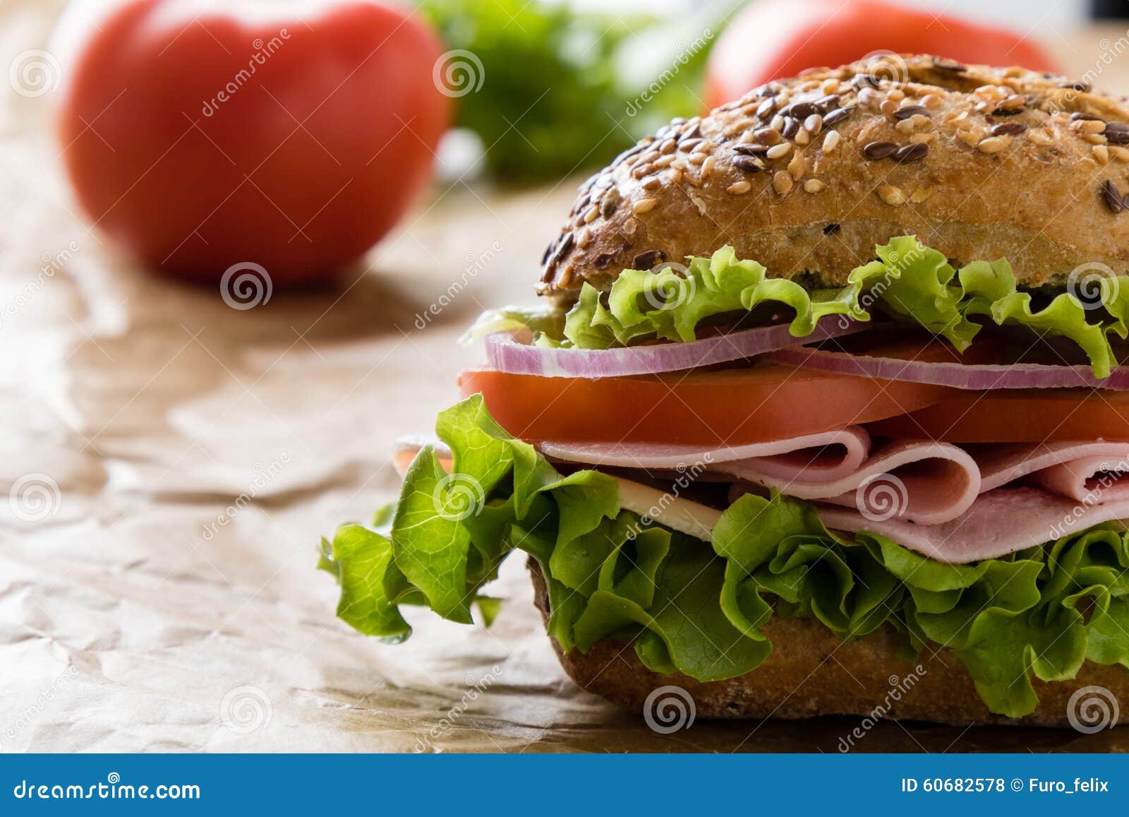 Brown Bun Ham Sandwich on Paper Stock Photo - Image of wheat, cold ...
