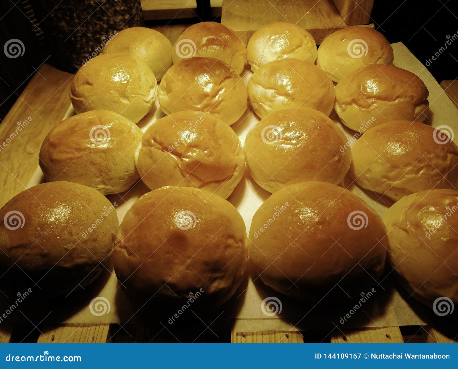 Brown Circle Bread Placed on White Paper Stock Image - Image of crust ...