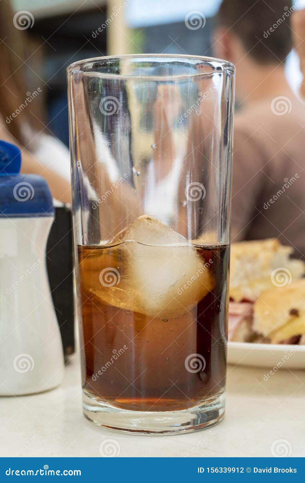 Brown cola soda in a glass stock photo. Image of table - 156339912