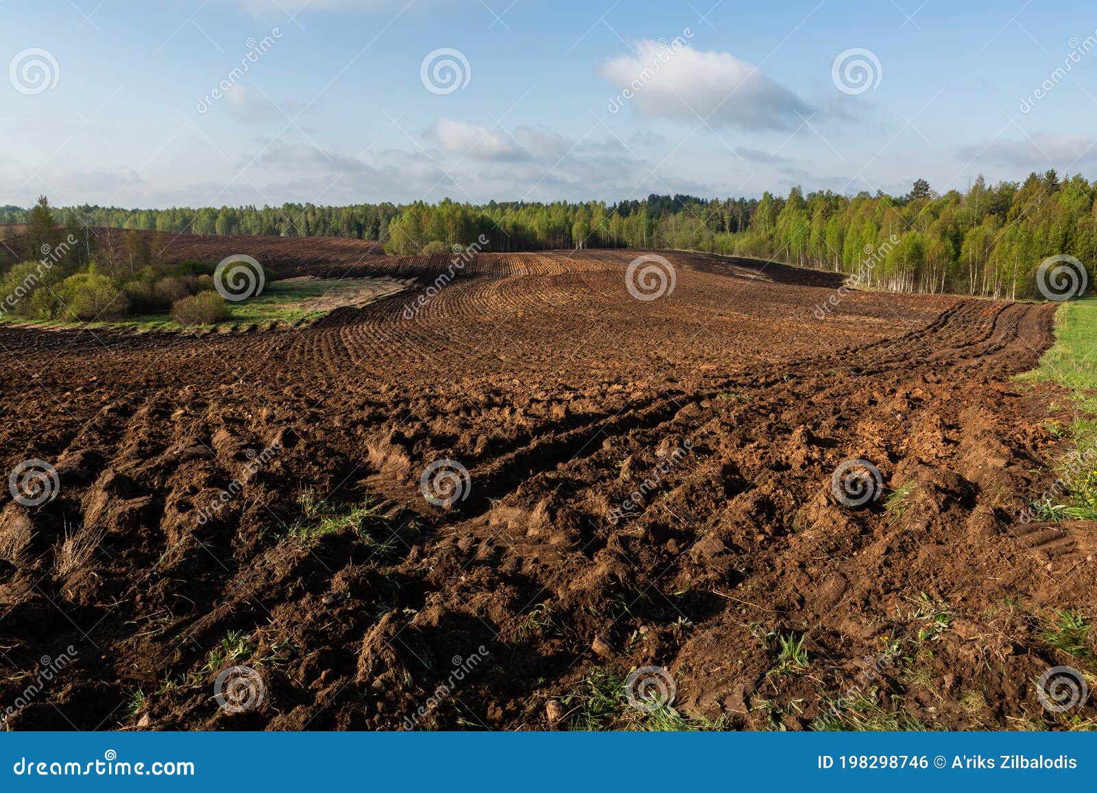 Plowed field in spring stock photo. Image of agronomy - 198298746