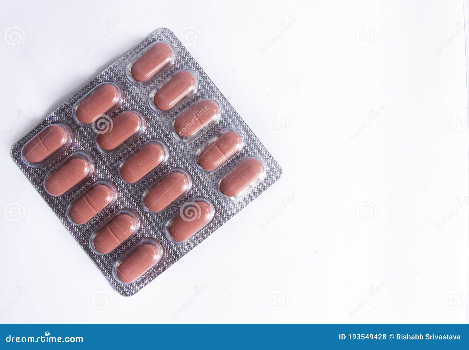 Brown Coloured Pills in Plastic Packaging on White Background Stock ...
