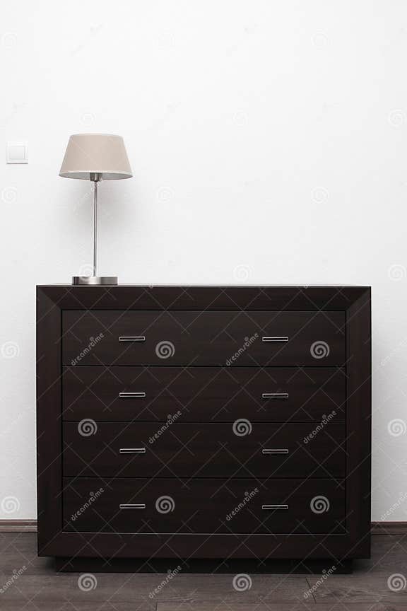Brown Commode with Lamp in Minimalism Interior Stock Image - Image of ...