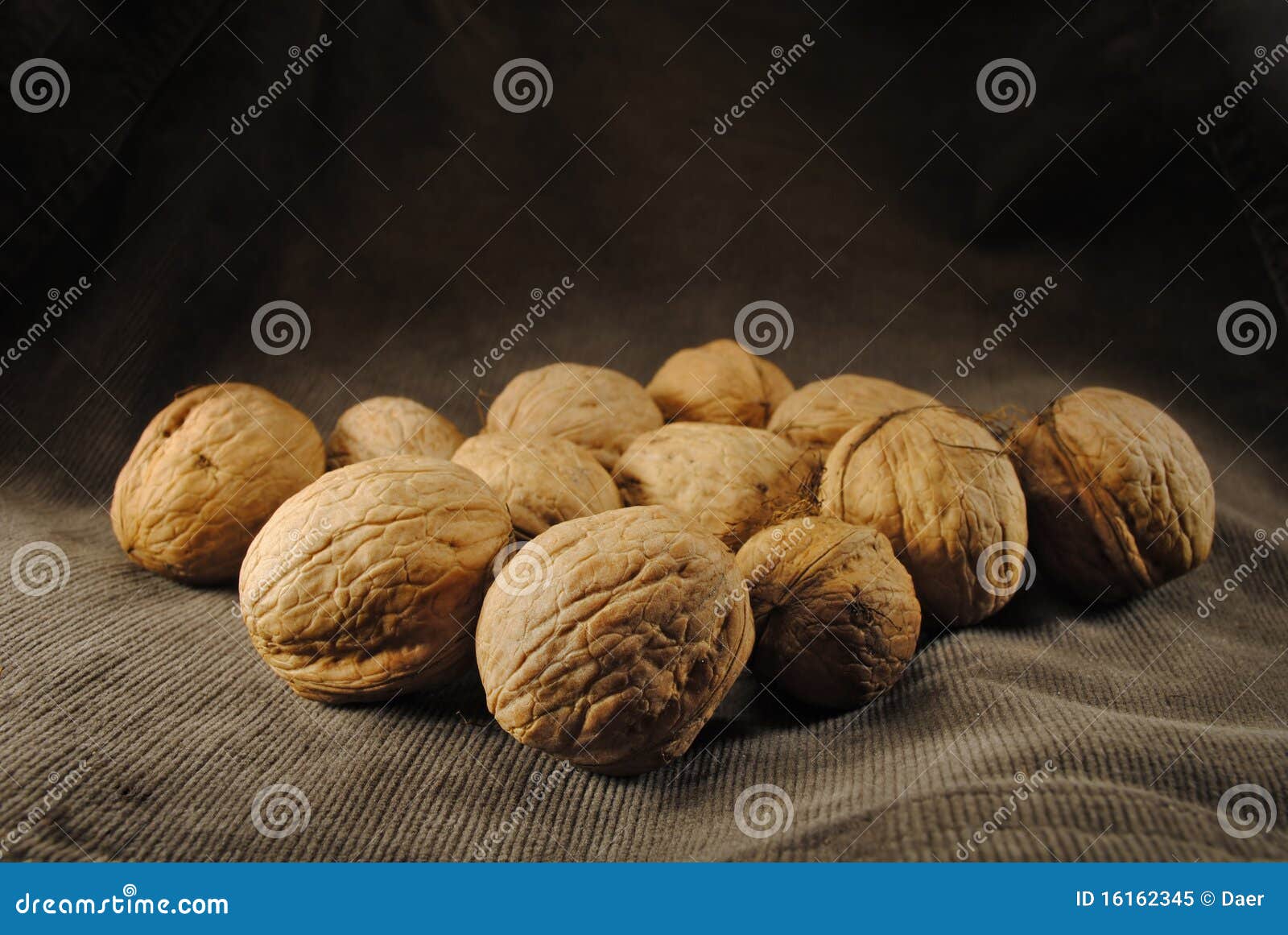Brown Delicious Nuts on the Dark Backround Stock Image - Image of ...