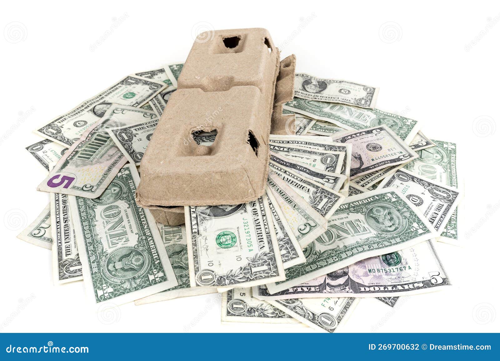 Brown Egg Carton of Eggs on a Pile of American Money Stock Photo ...