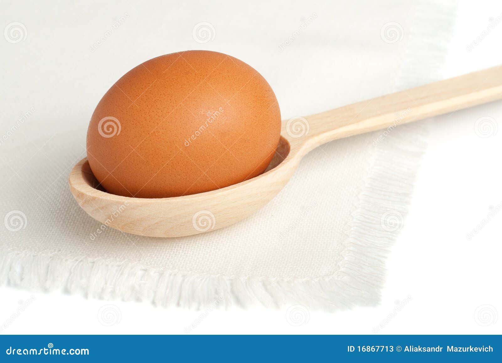 Brown Egg in a Wooden Spoon Stock Image - Image of cooking, cotton ...