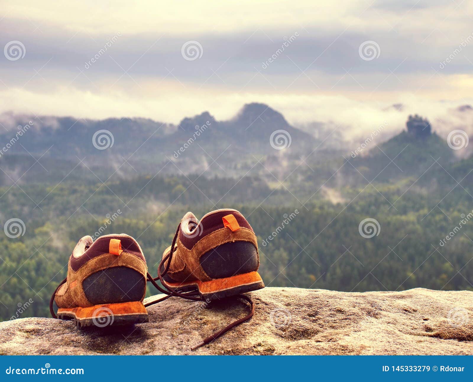 Brown Hiking Boots on Rocks in Front of Mountain Range Stock Image ...