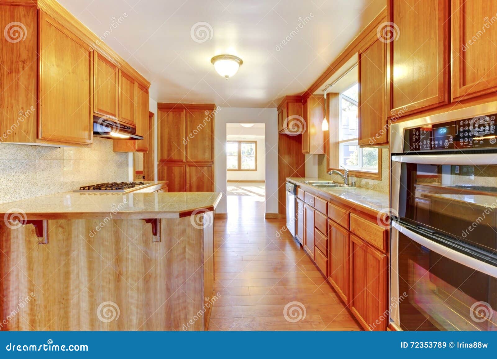 Brown Kitchen Interior with Hardwood Floor Stock Image - Image of ...