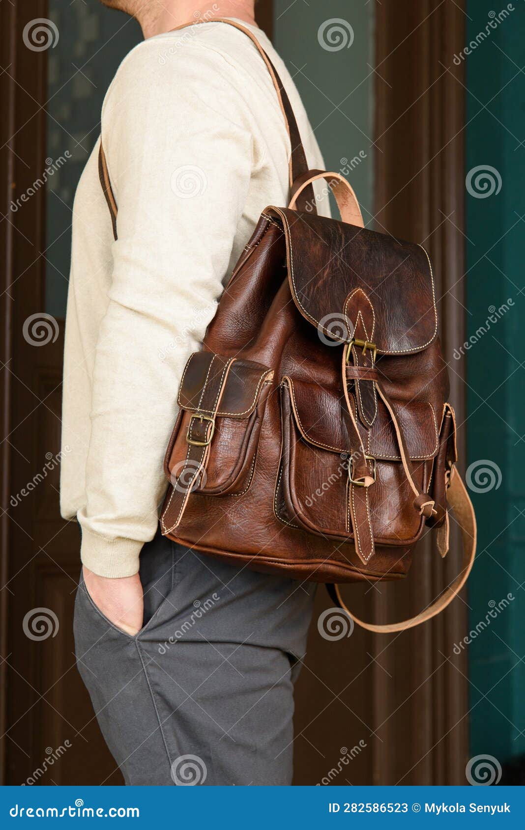 Brown Leather Oldfashioned Backpack on a Mans Back Stock Image - Image ...