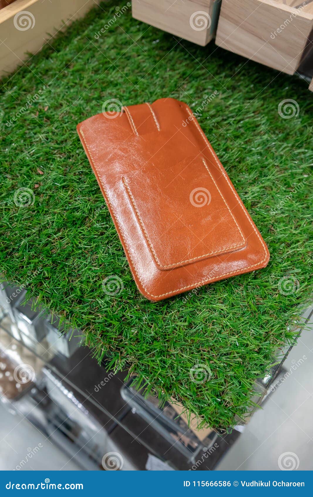 Brown Leather Phone Case on Artificial Grass for Display Stock Photo ...