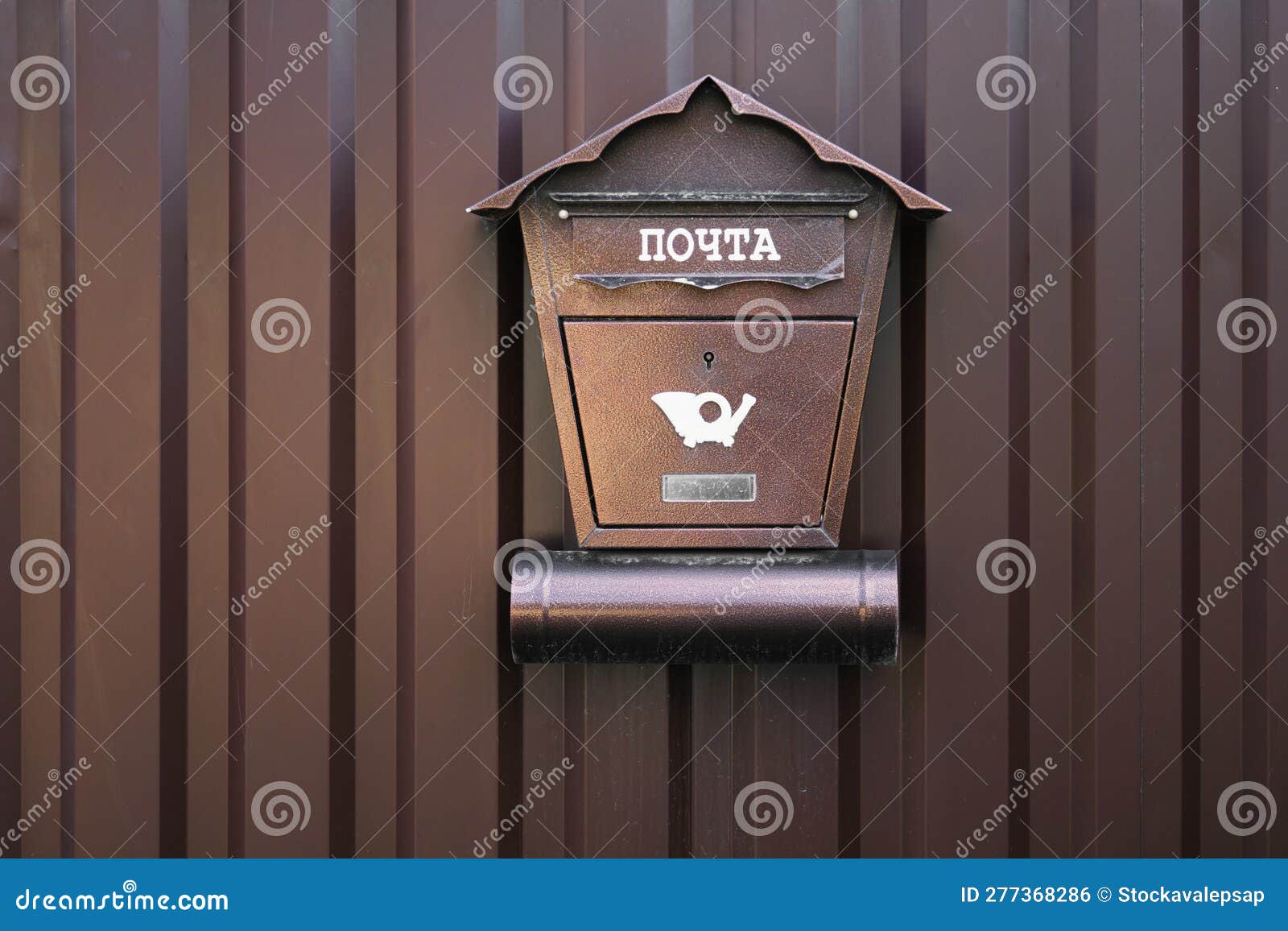 Brown Metal Mailbox on Red Wall. Traditional Post Box with Text MAIL in ...