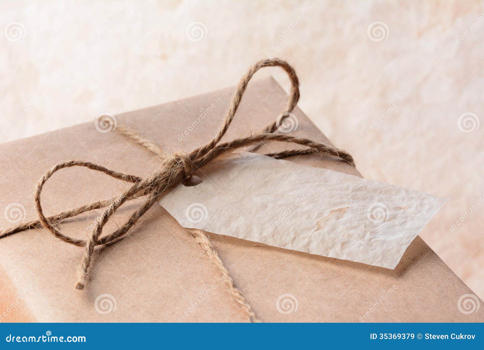 Brown Paper Wrapped Package with Gift Tag Stock Image - Image of kraft ...