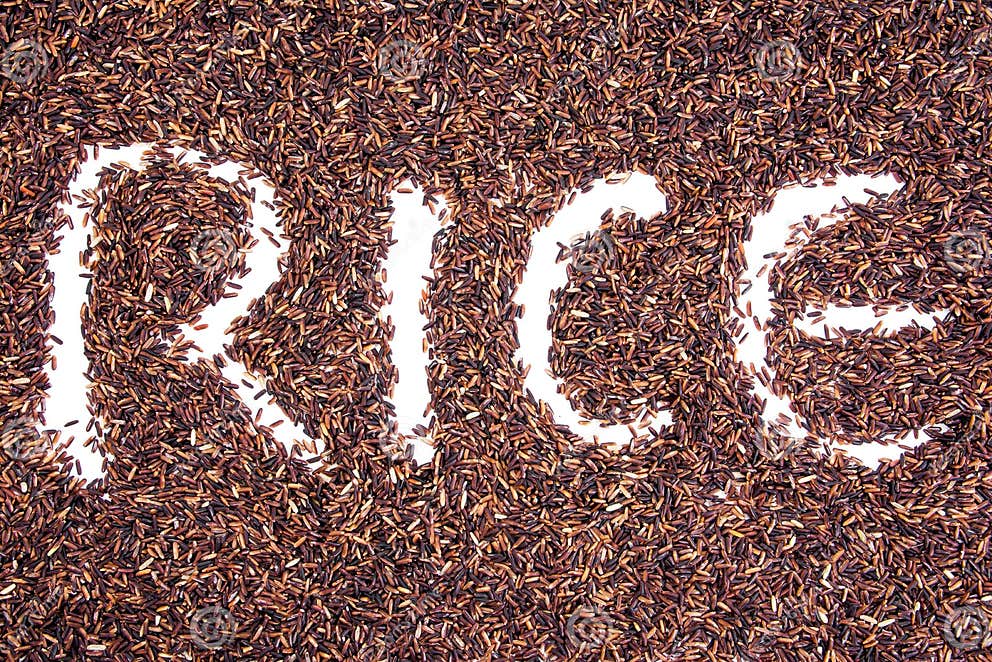 Brown Rice in Alphabet Writing Rice Background Texture Stock Photo ...