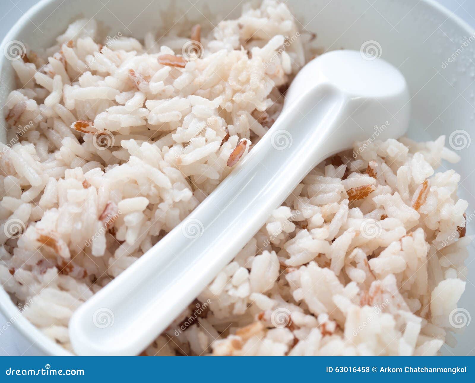 Brown rice in the box stock photo. Image of spoon, delicious - 63016458