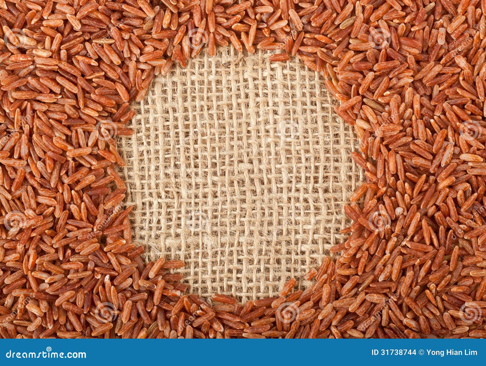 Brown Rice on Burlap Fabric Stock Photo - Image of fabric, background ...