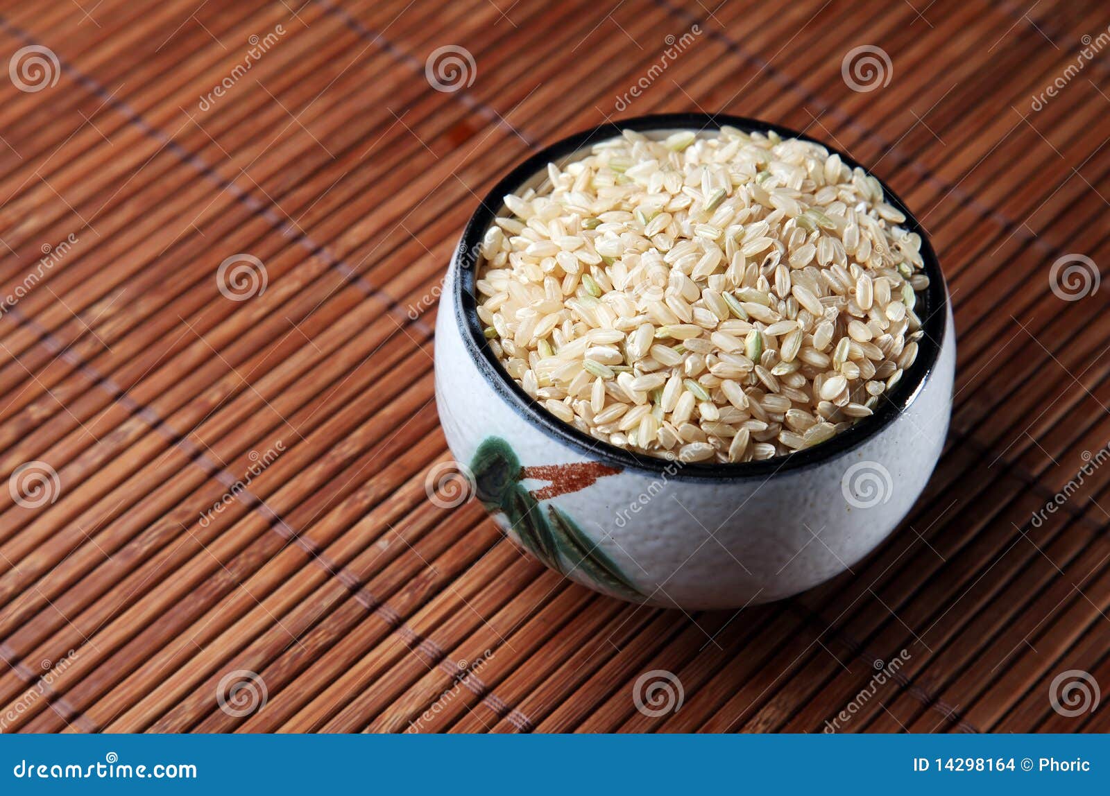 Brown Rice in a cup stock photo. Image of pile, closeup - 14298164