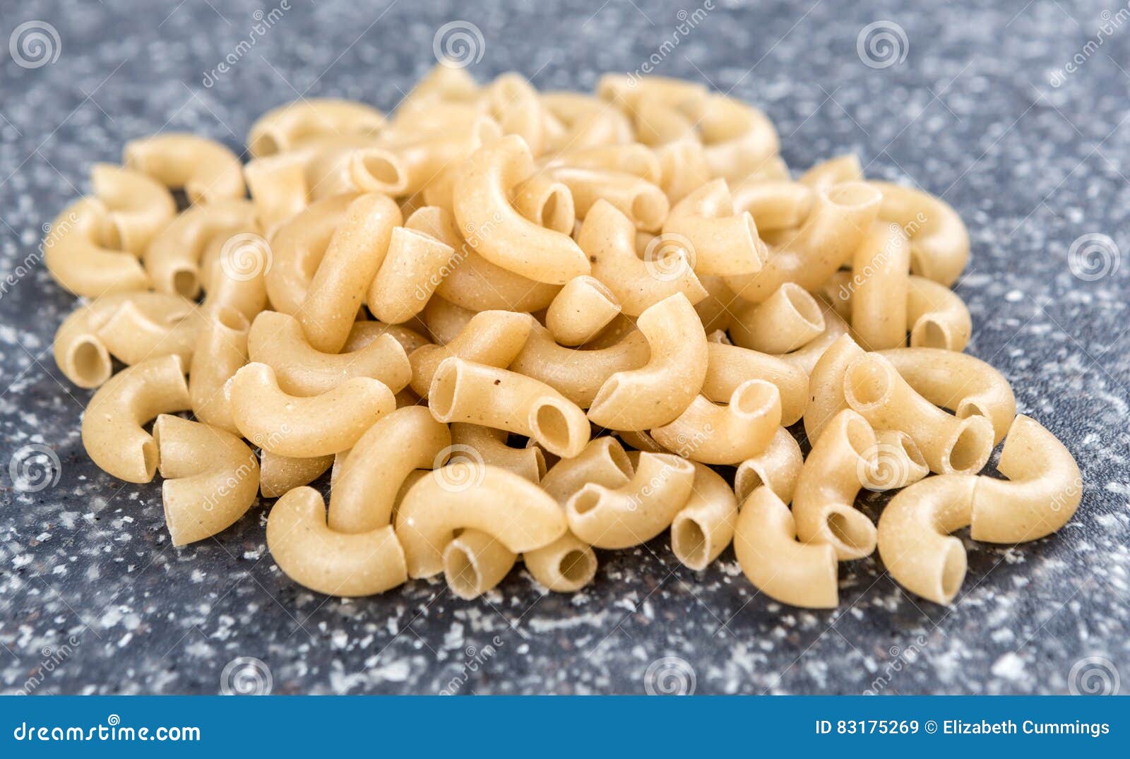 Brown rice elbow macaroni stock image. Image of isolated - 83175269