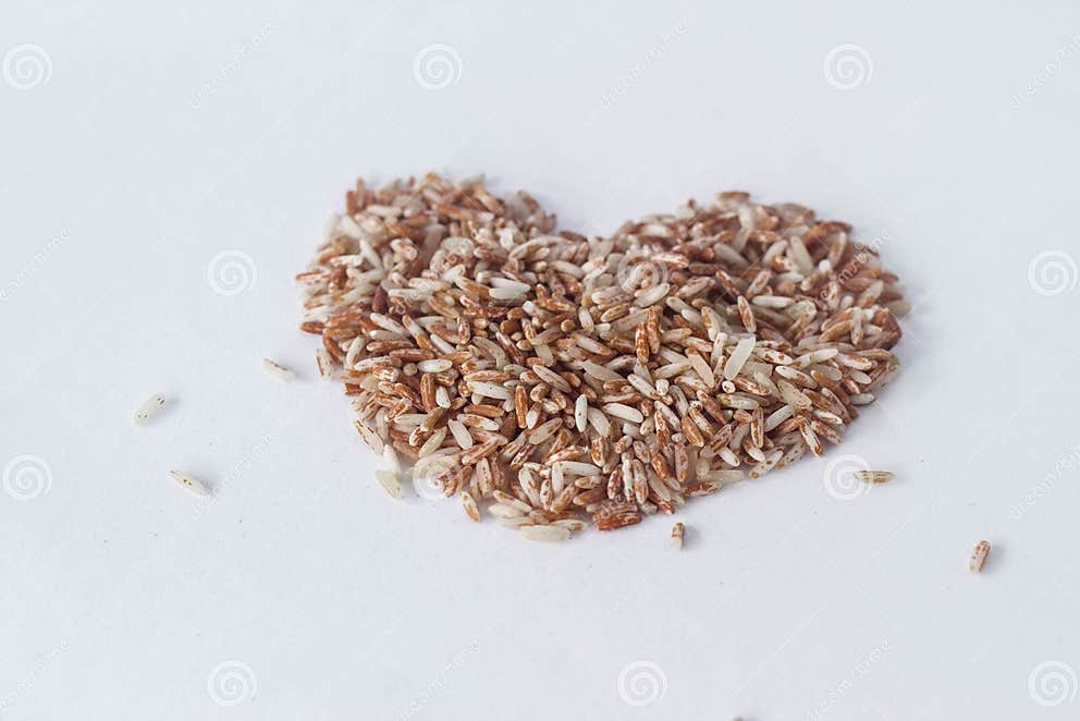 Brown rice in heart shape stock image. Image of ingredient - 85669113