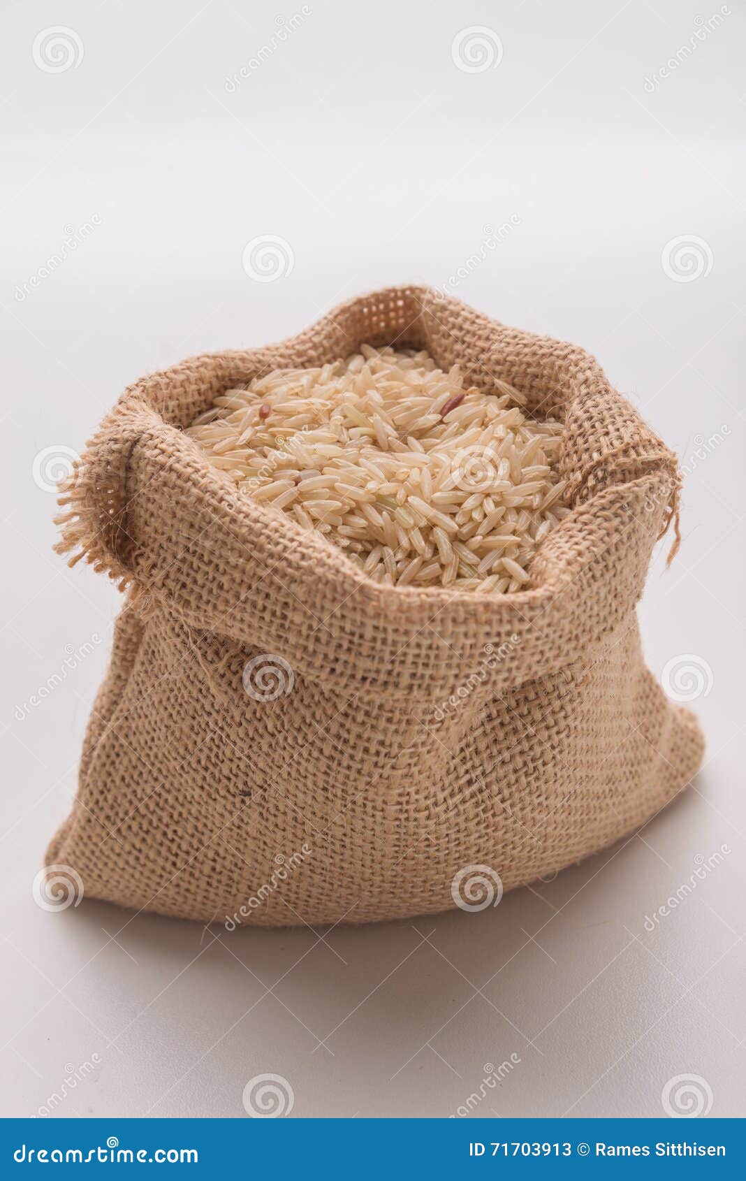 Brown rice in mini sack stock image. Image of basmati - 71703913