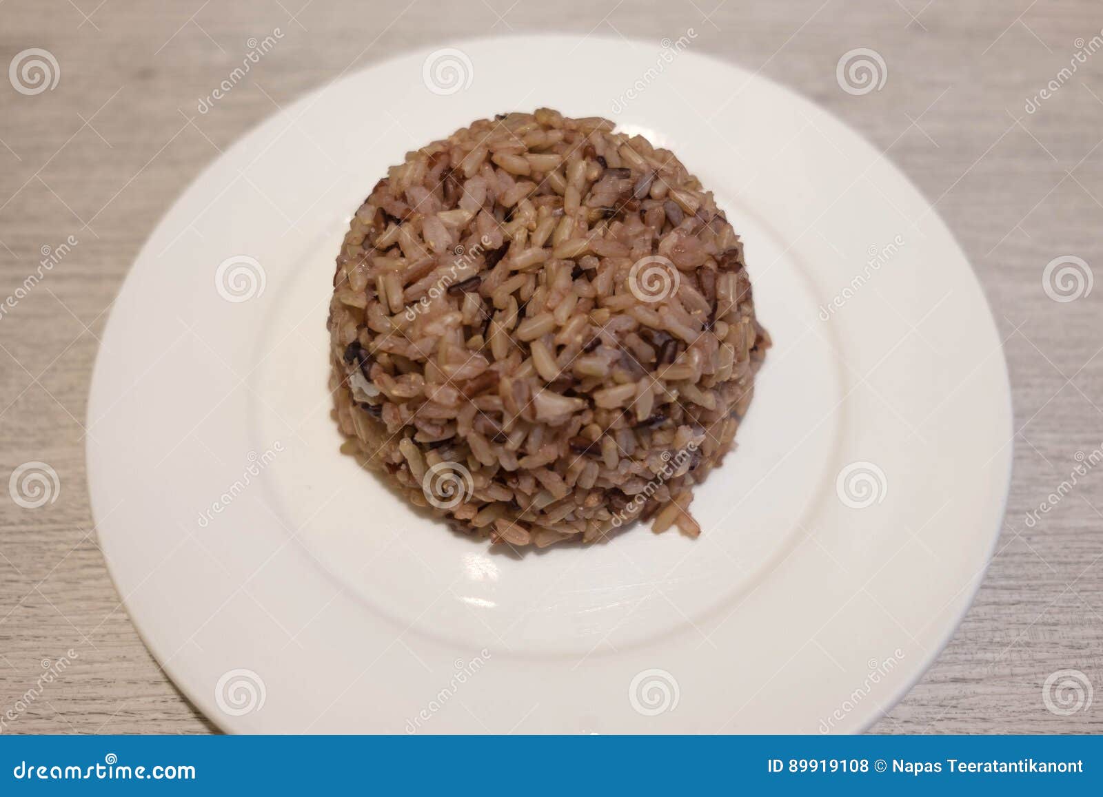 Brown Rice on the White Circle Plate Stock Photo - Image of brown ...