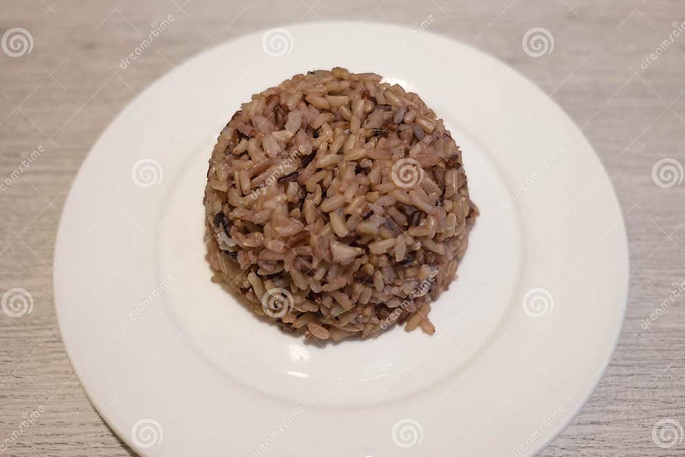 Brown Rice on the White Circle Plate Stock Photo - Image of brown ...