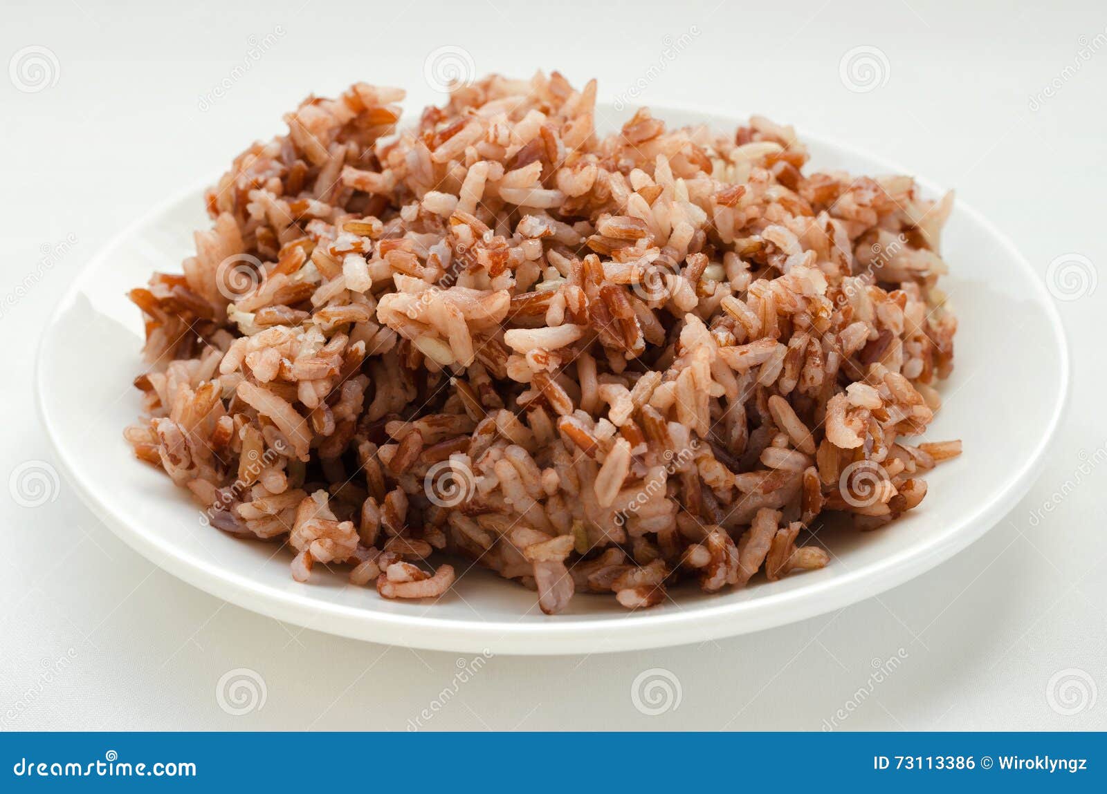 Brown Rice on White Plate. stock photo. Image of cooked - 73113386