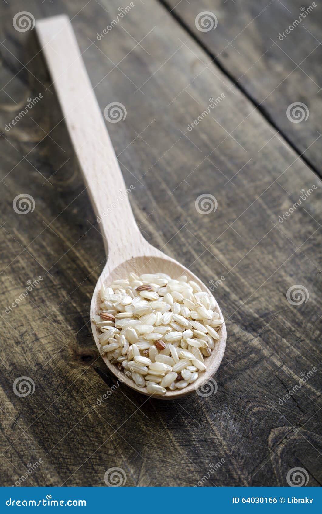 Brown rice in wooden spoon stock photo. Image of wooden - 64030166