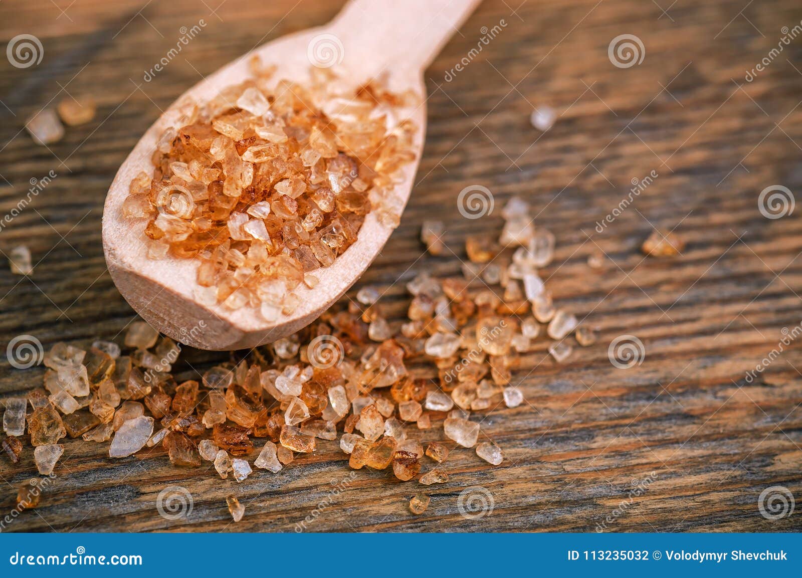 Brown salt in wooden spoon stock photo. Image of himalayan - 113235032
