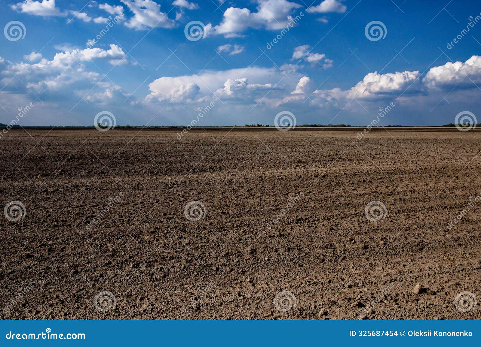 Brown Soil of a Large, Empty Farmland and Clouds Stock Photo - Image of ...