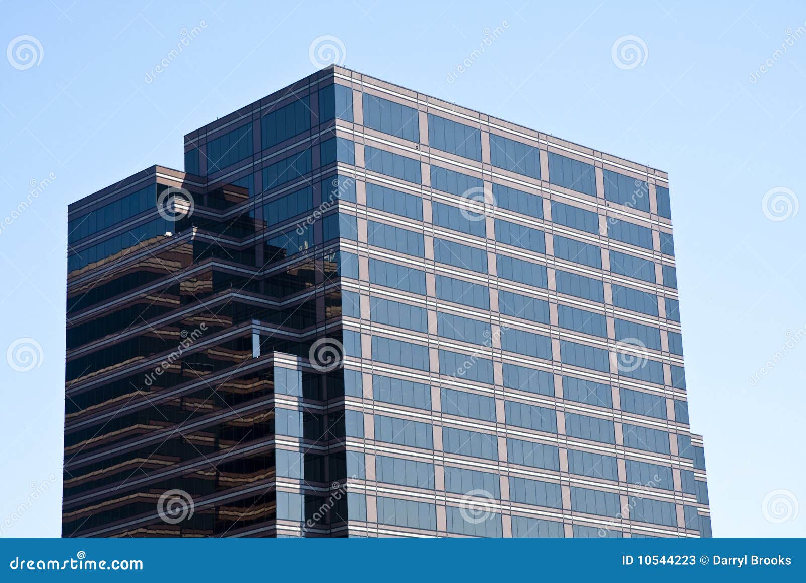 Brown Striped Glass Tiered Building on Blue Stock Image - Image of ...