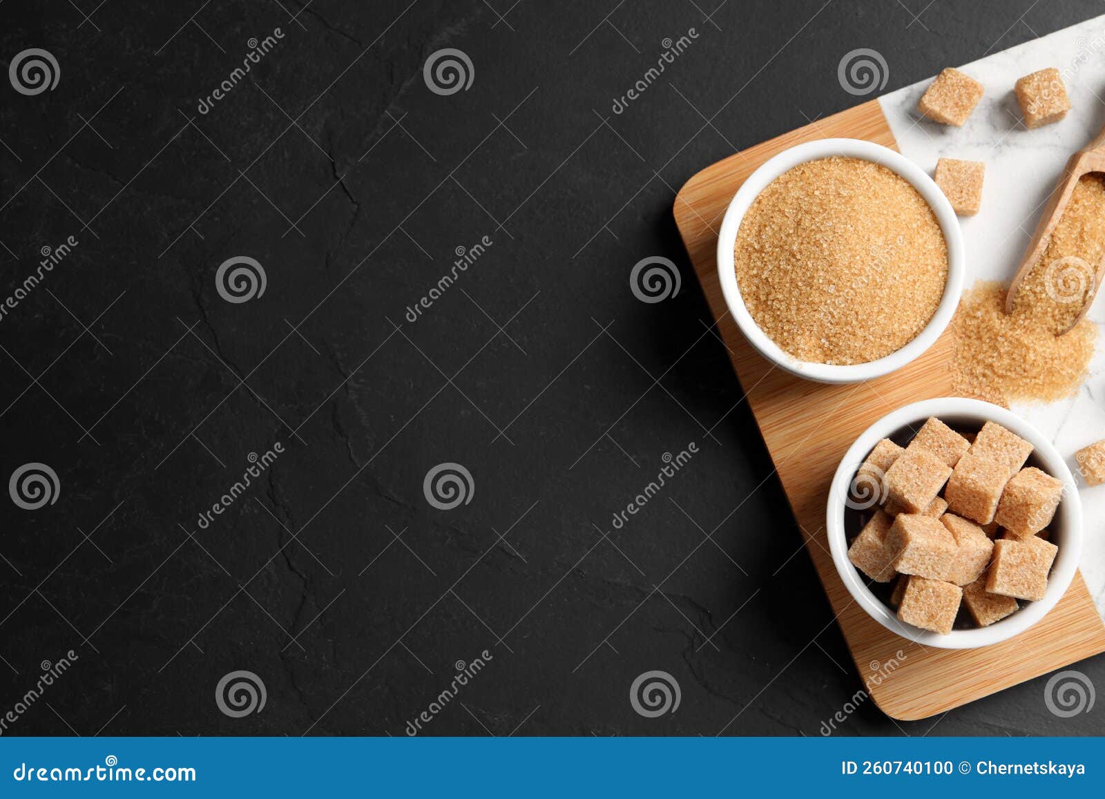 Brown Sugar and Board on Black Table, Top View. Space for Text Stock ...