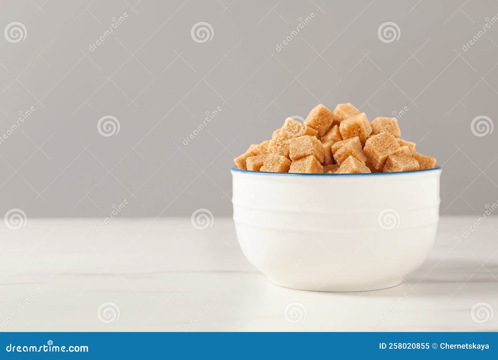 Brown Sugar Cubes in Bowl on White Table, Space for Text Stock Image ...