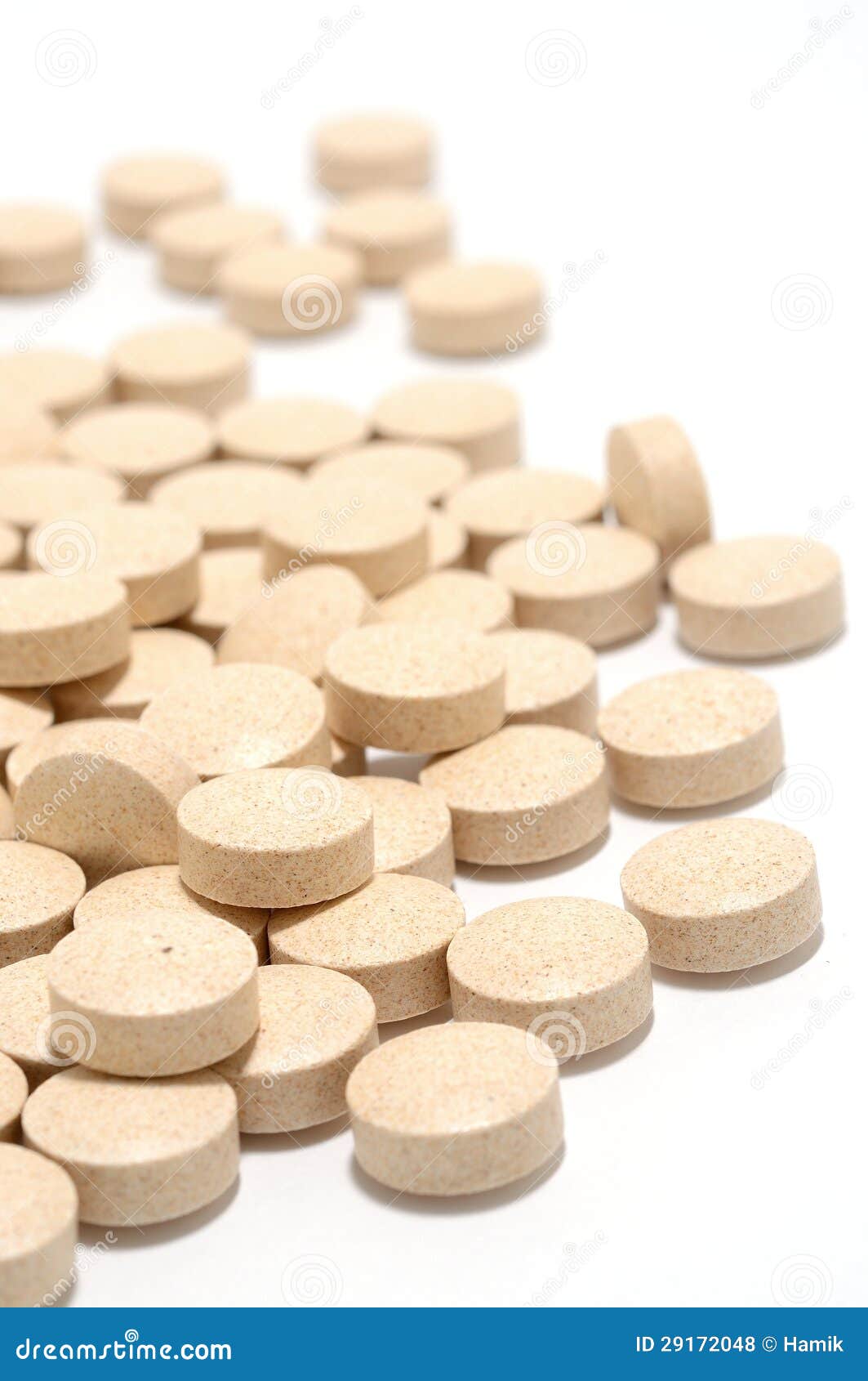 Brown Tablets Falling Out Of An Open Package On A Dark Mirror ...