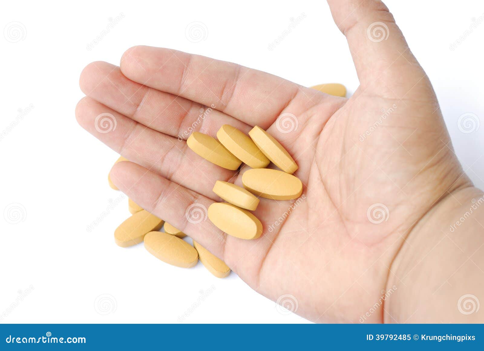 Brown tablets in hand stock image. Image of vitamin, pills - 39792485
