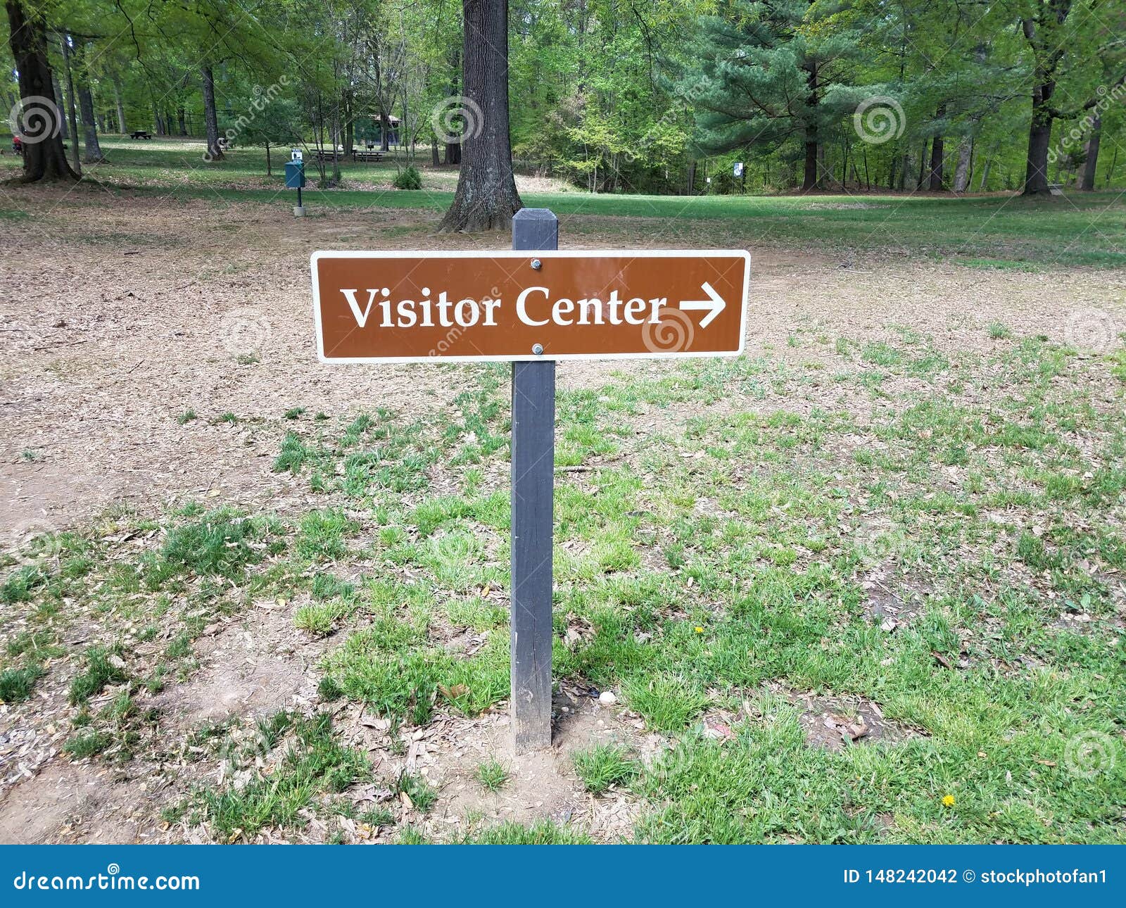 Brown Visitor Center Sign with White Right Arrow and Grass Stock Photo ...