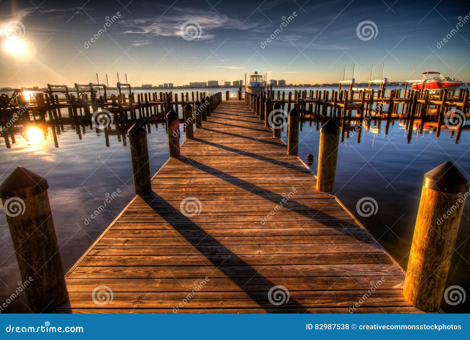 Brown Wooden Dock On Blue Water Under White Clouds And Blue Sky During ...
