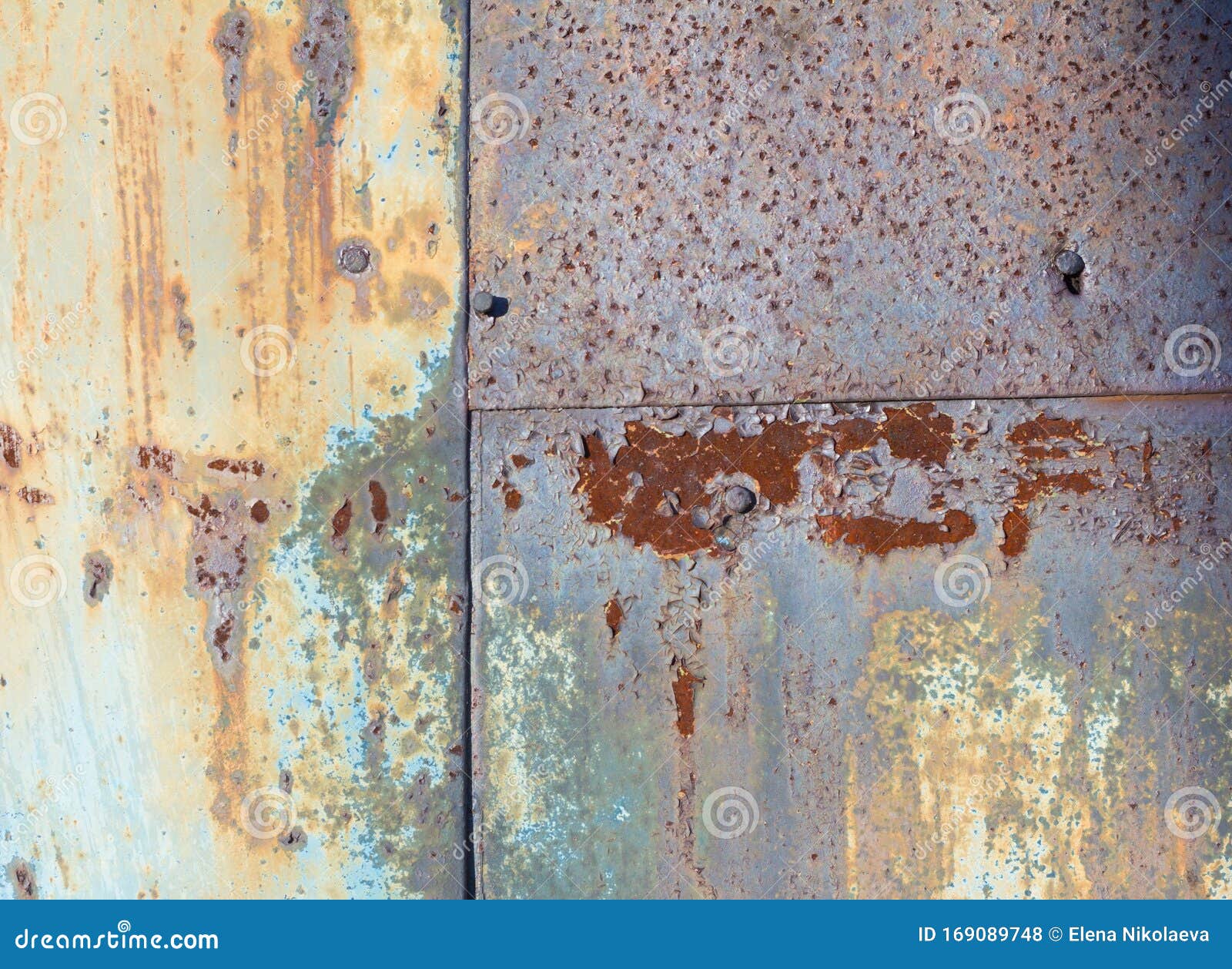 Brown and Yellow Rust on the Metal Sheet with the Remnants of Blue ...