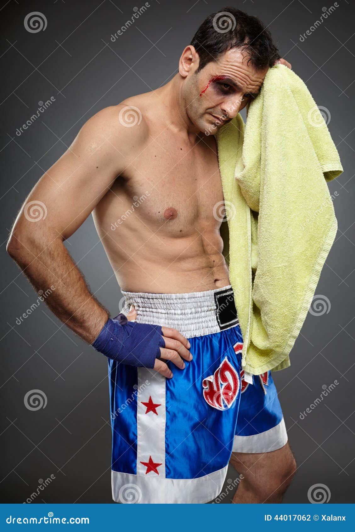 Bruised fighter with towel stock photo. Image of combat - 44017062