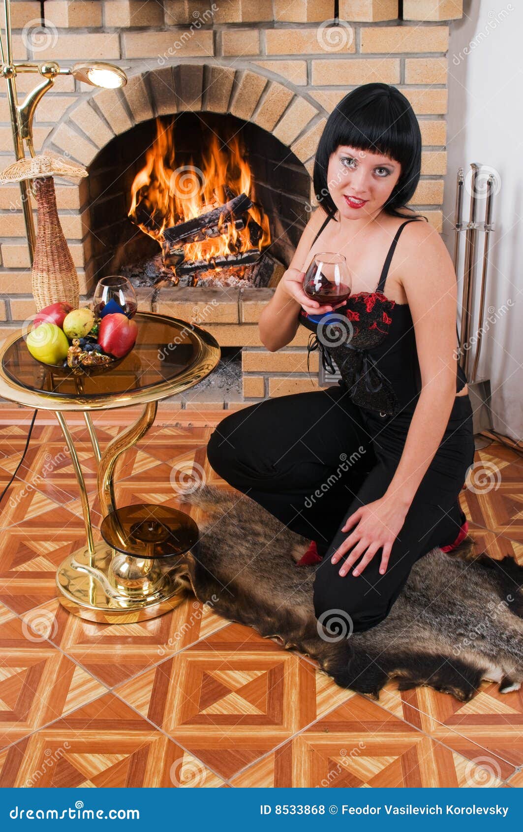 The Brunette and a Burning Fireplace. Stock Photo - Image of girl ...