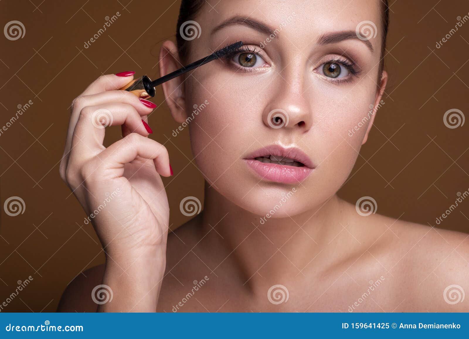Brunette Caucasian Woman Apply Mascara With A Brush Flawless Clean