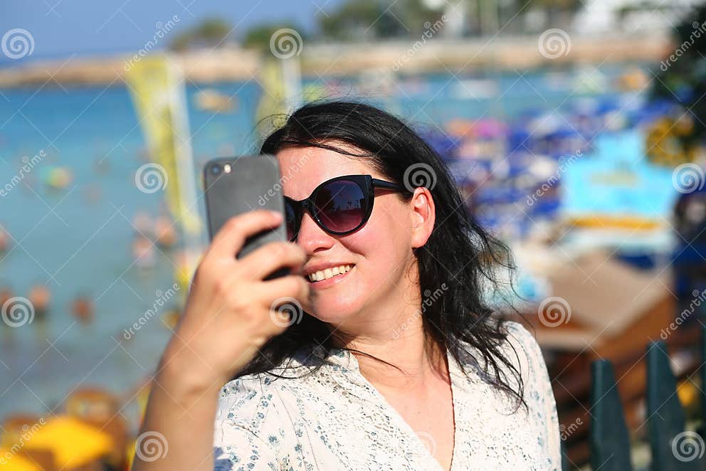 Brunette Caucasian Woman Taking Selfie On The Beach Closeup Portrait