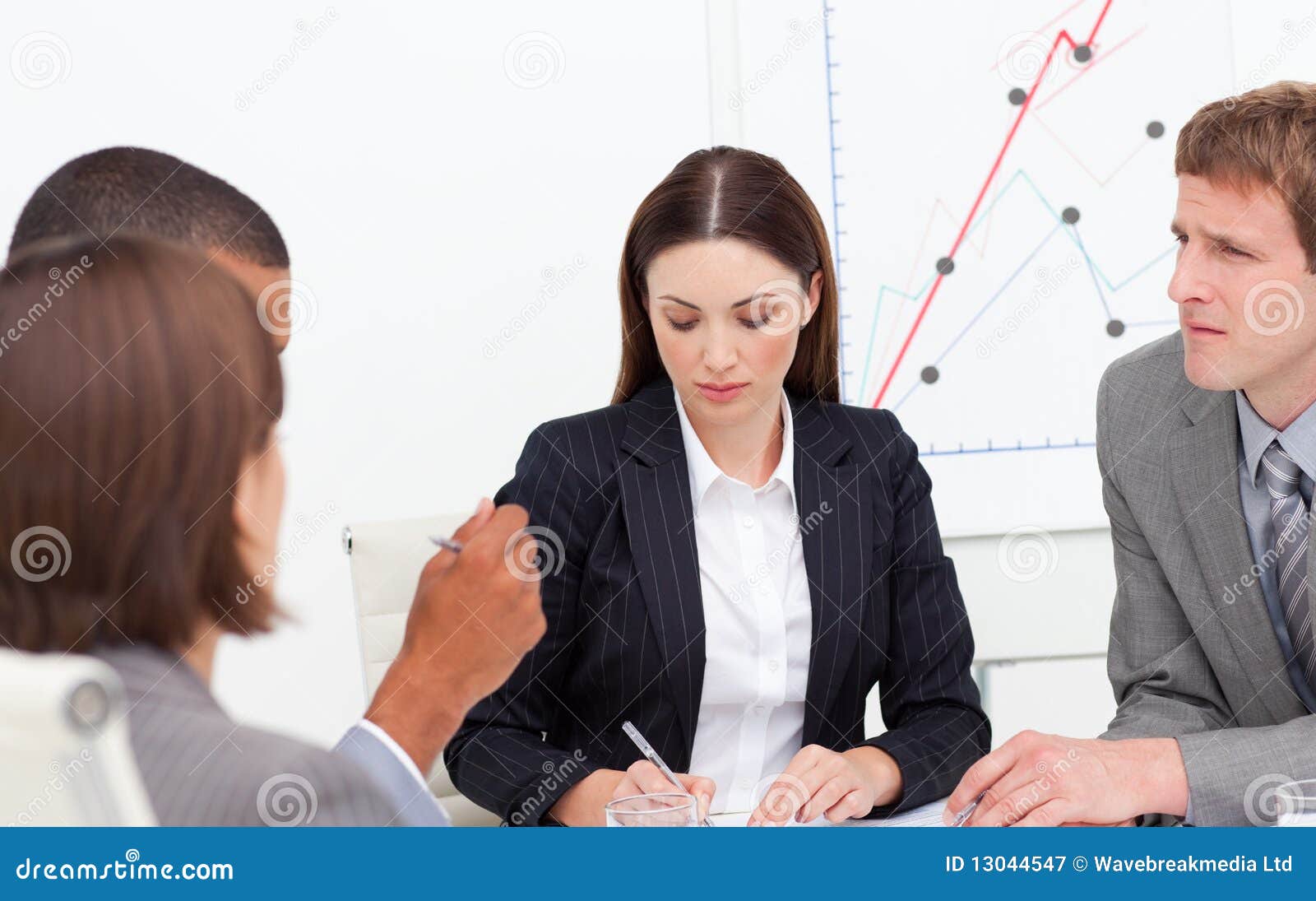 Brunette Female Executive Presenting Statistics Stock Image - Image of ...