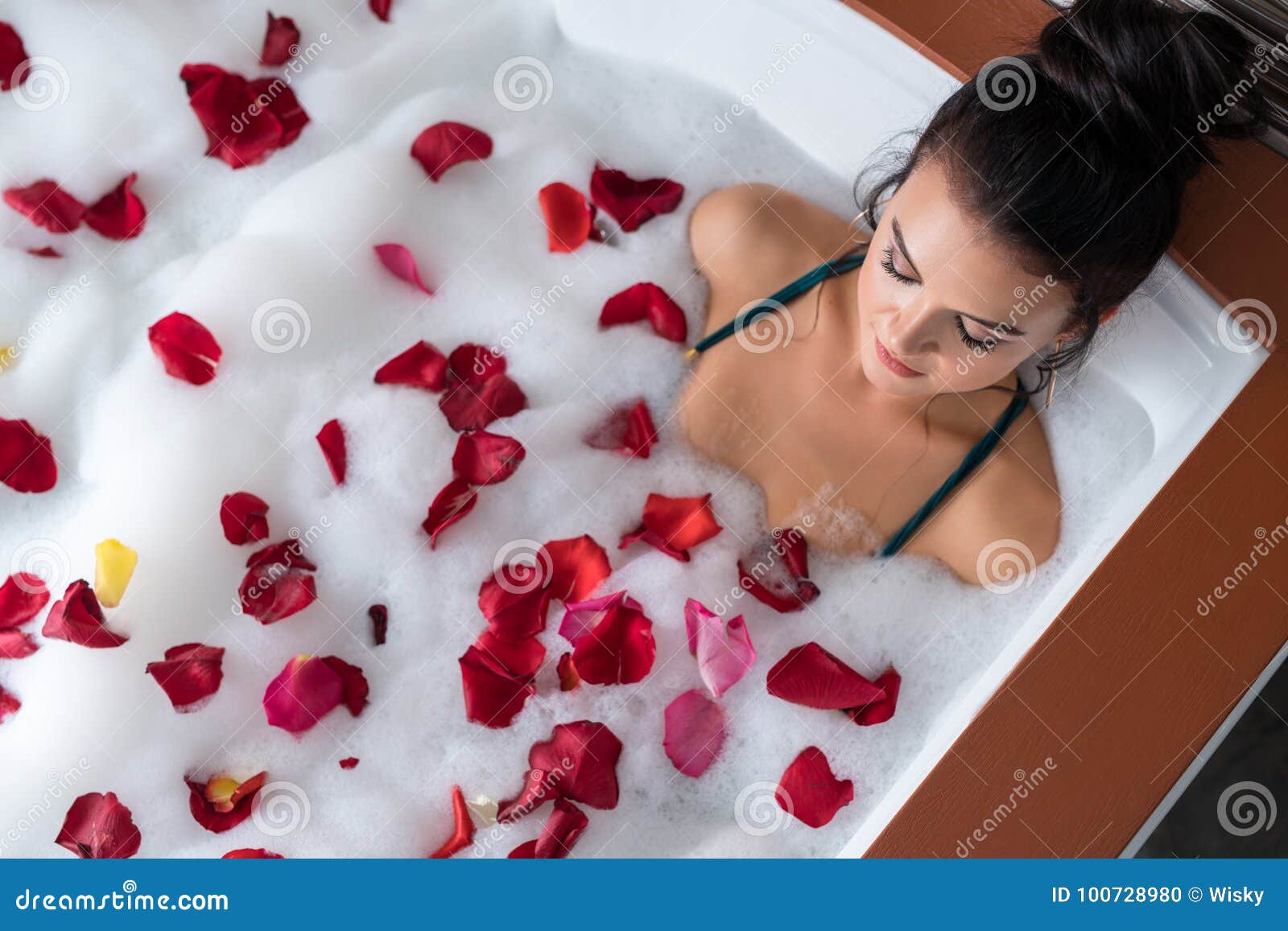 Brunette in Jacuzzi with Rose Petals Top View Stock Photo - Image of ...
