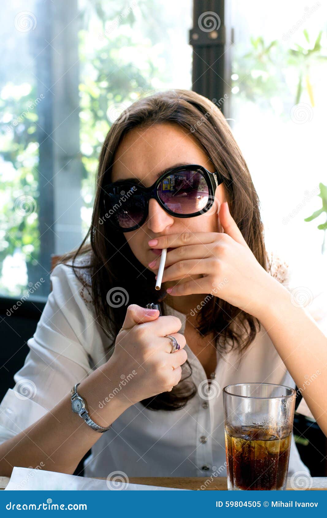 Brunette Lighting a Cigarette in a Cafe Stock Image - Image of time ...