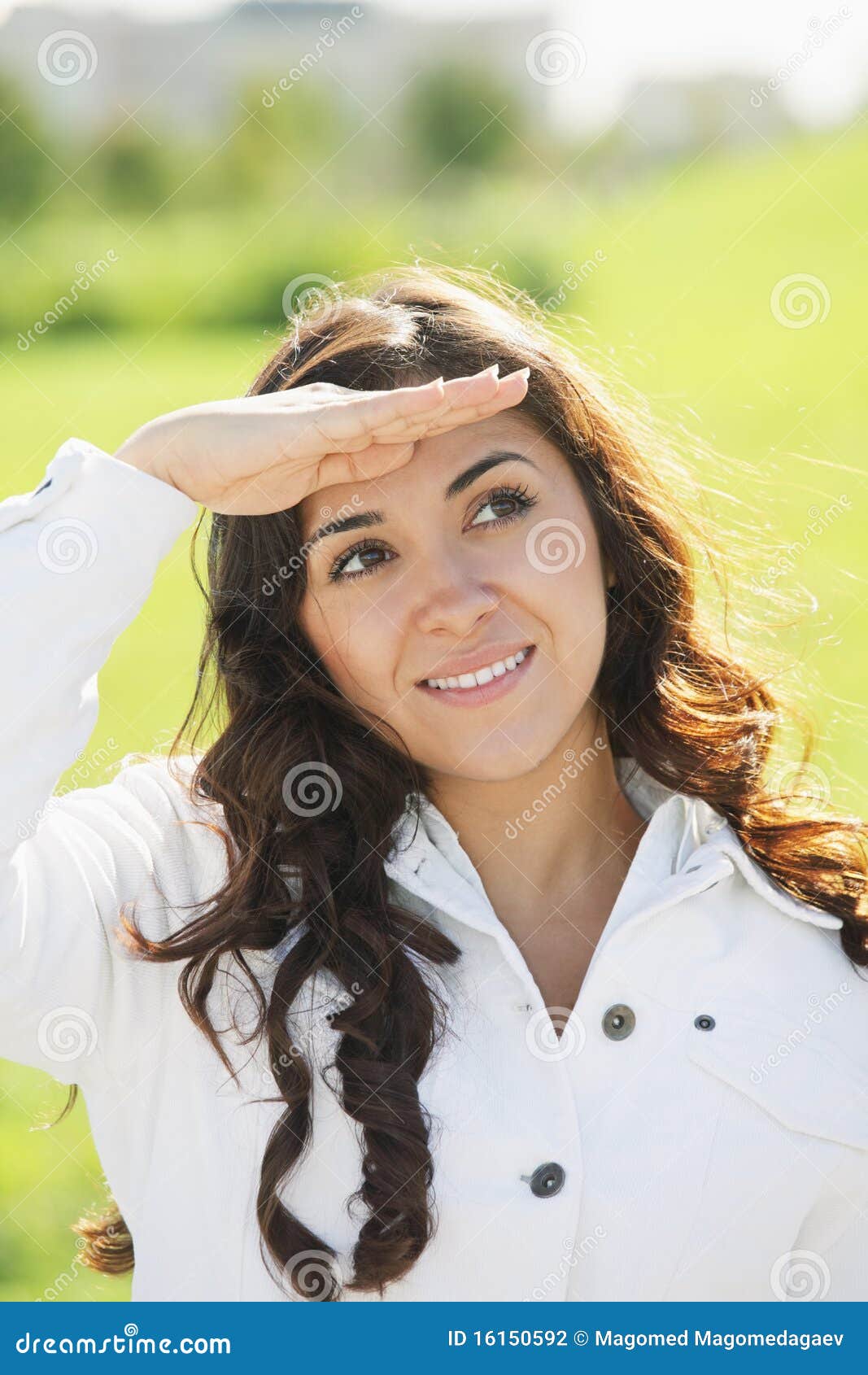 Brunette Looking Up from Under Hand Peak Stock Photo - Image of eyes ...