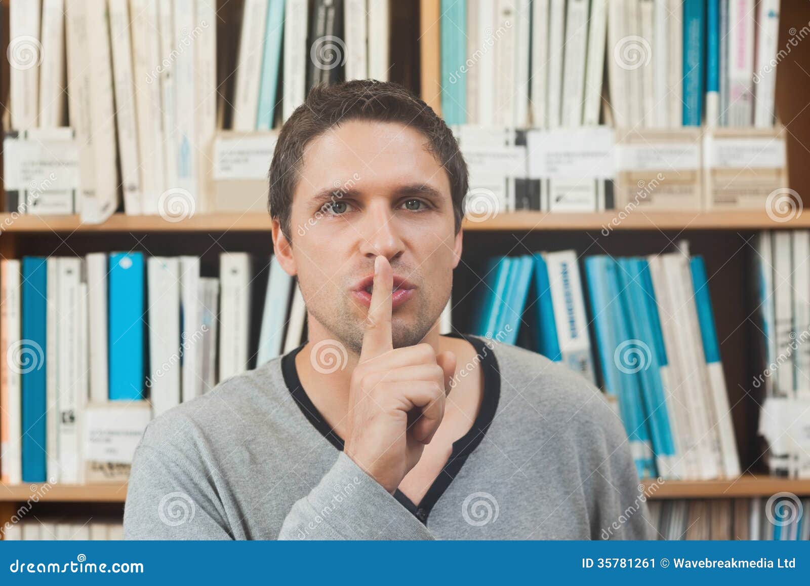 Brunette Male Librarian Requesting Silence in Library Stock Image ...