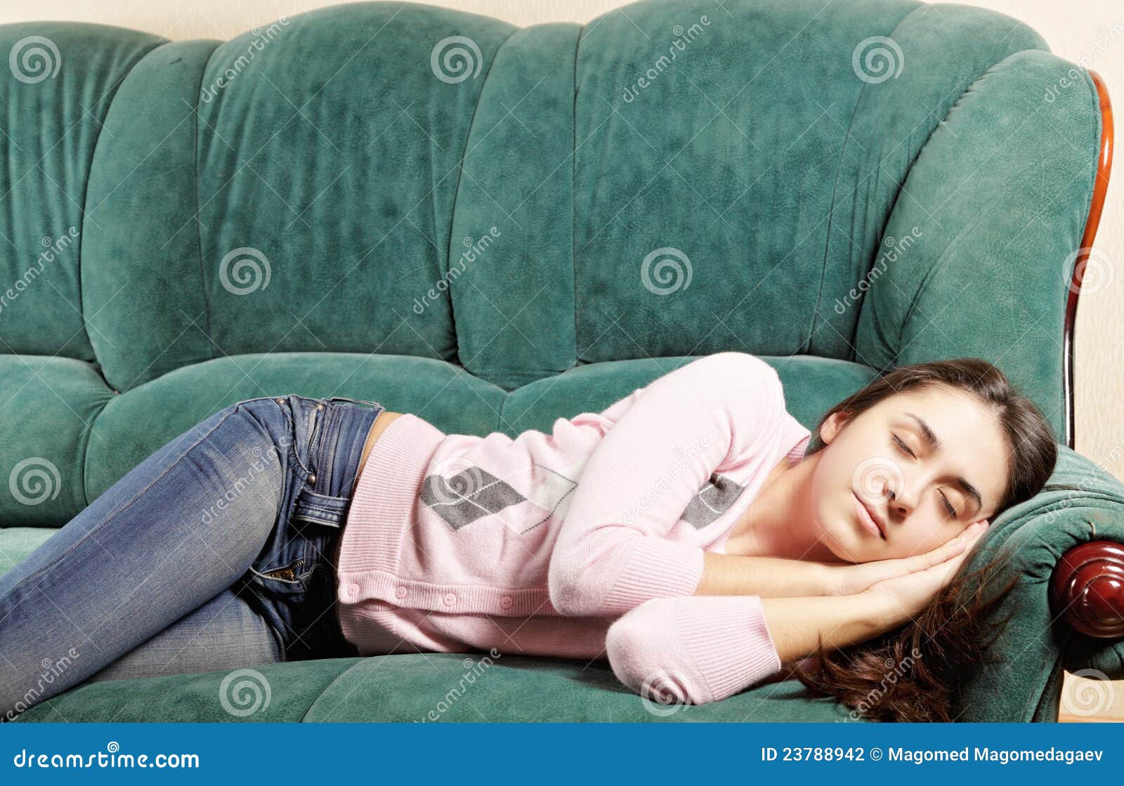 Brunette Napping on Green Sofa Stock Photo - Image of casual, cosiness ...