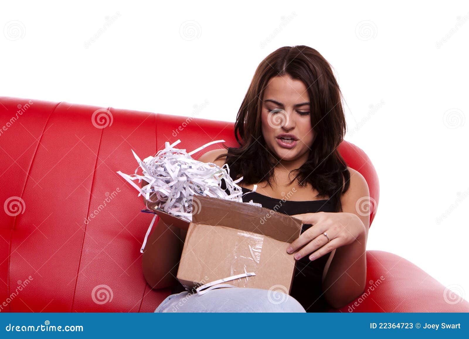 Brunette opening a parcel. stock image. Image of parcel - 22364723