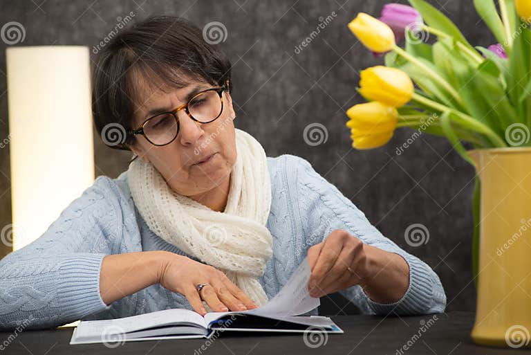 Brunette Senior Woman With Glasses Reading Book Stock Image Image Of