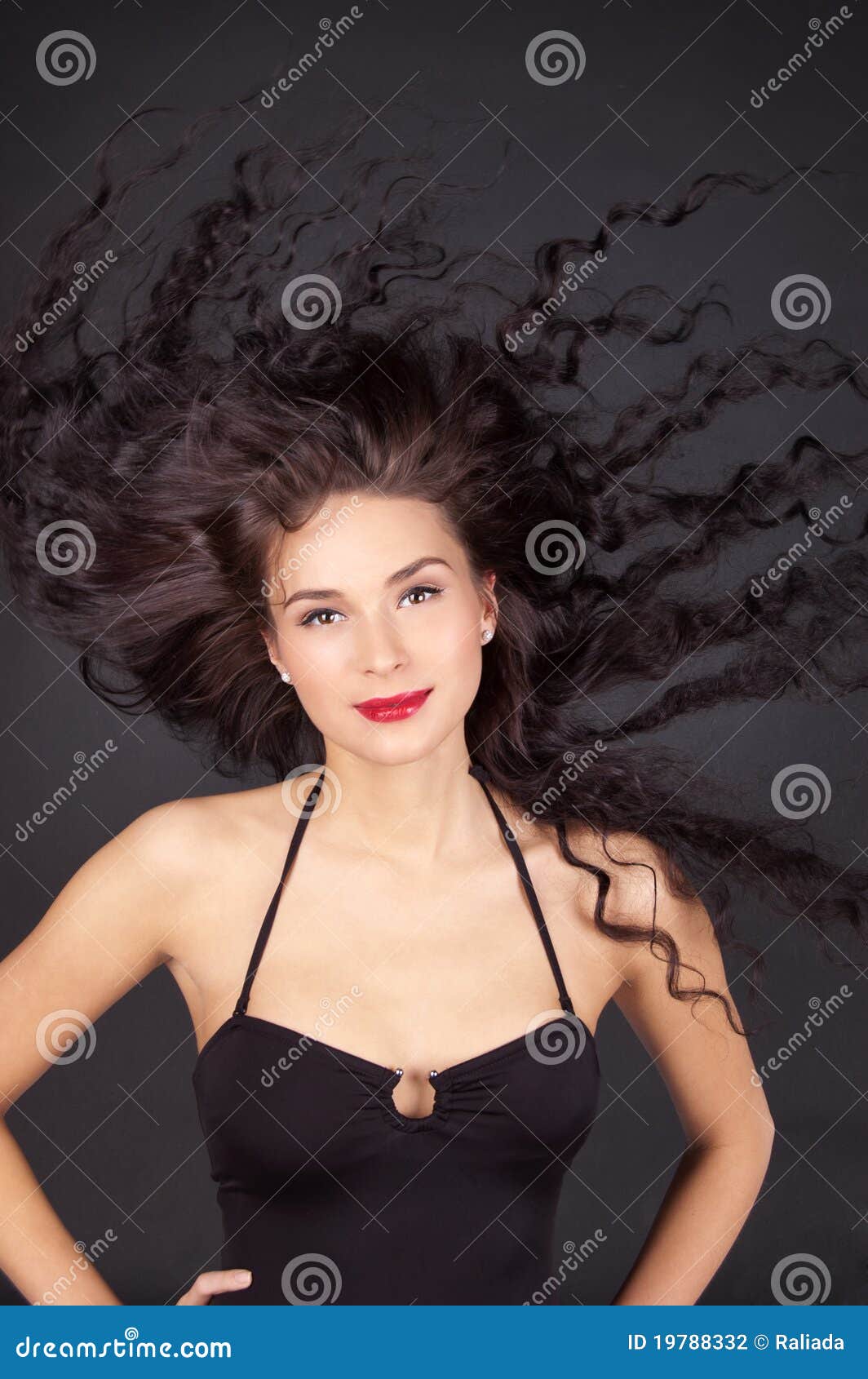Brunette Woman with Her Hair in Movement Stock Photo - Image of ...