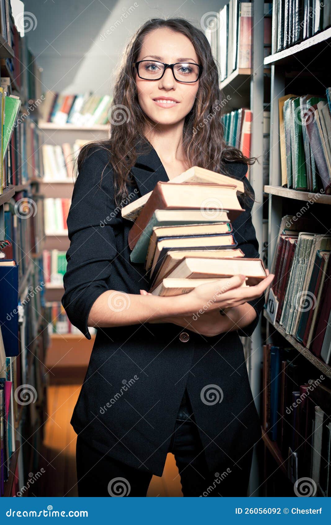 Brunette woman at library stock photo. Image of attractive - 26056092